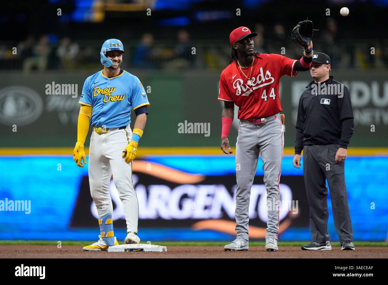 Milwaukee Brewers' Garrett Mitchell, left, smiles after hitting a ...