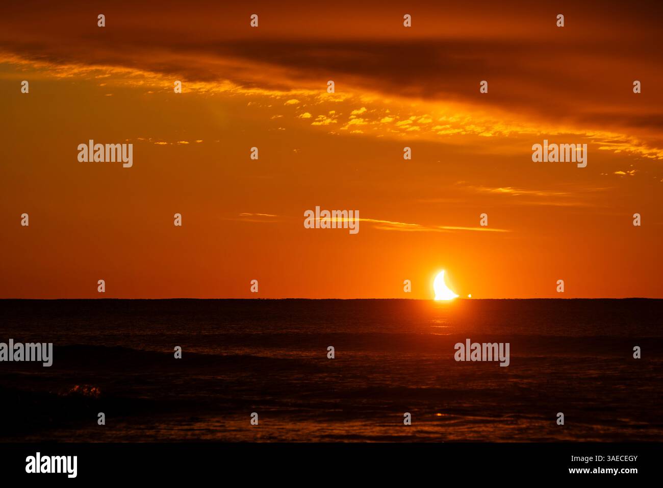 Partial solar eclipse captured at sunrise from Dartmouth, Nova Scotia ...