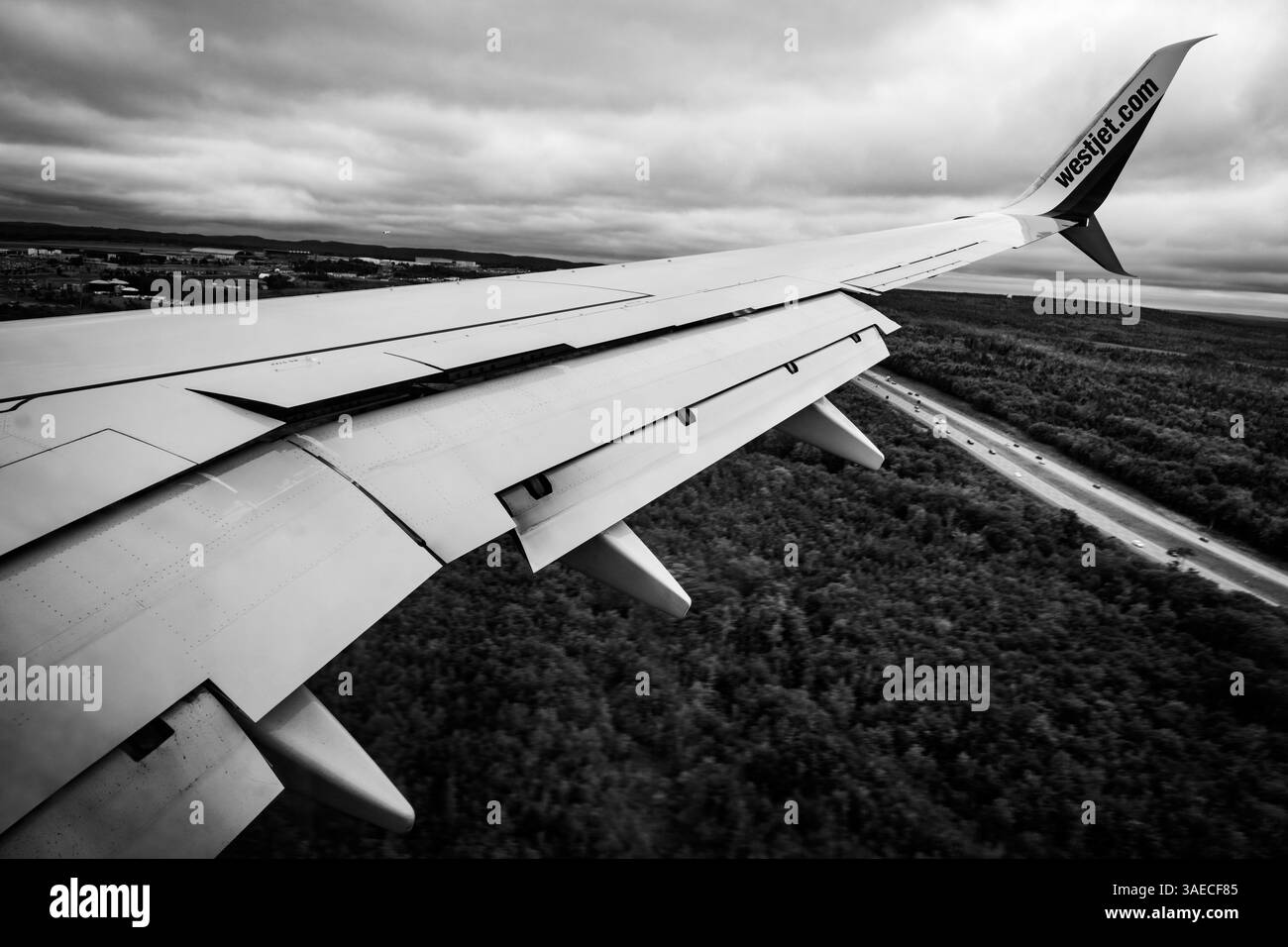 View of a highway and landscape from an airplane about to land at ...