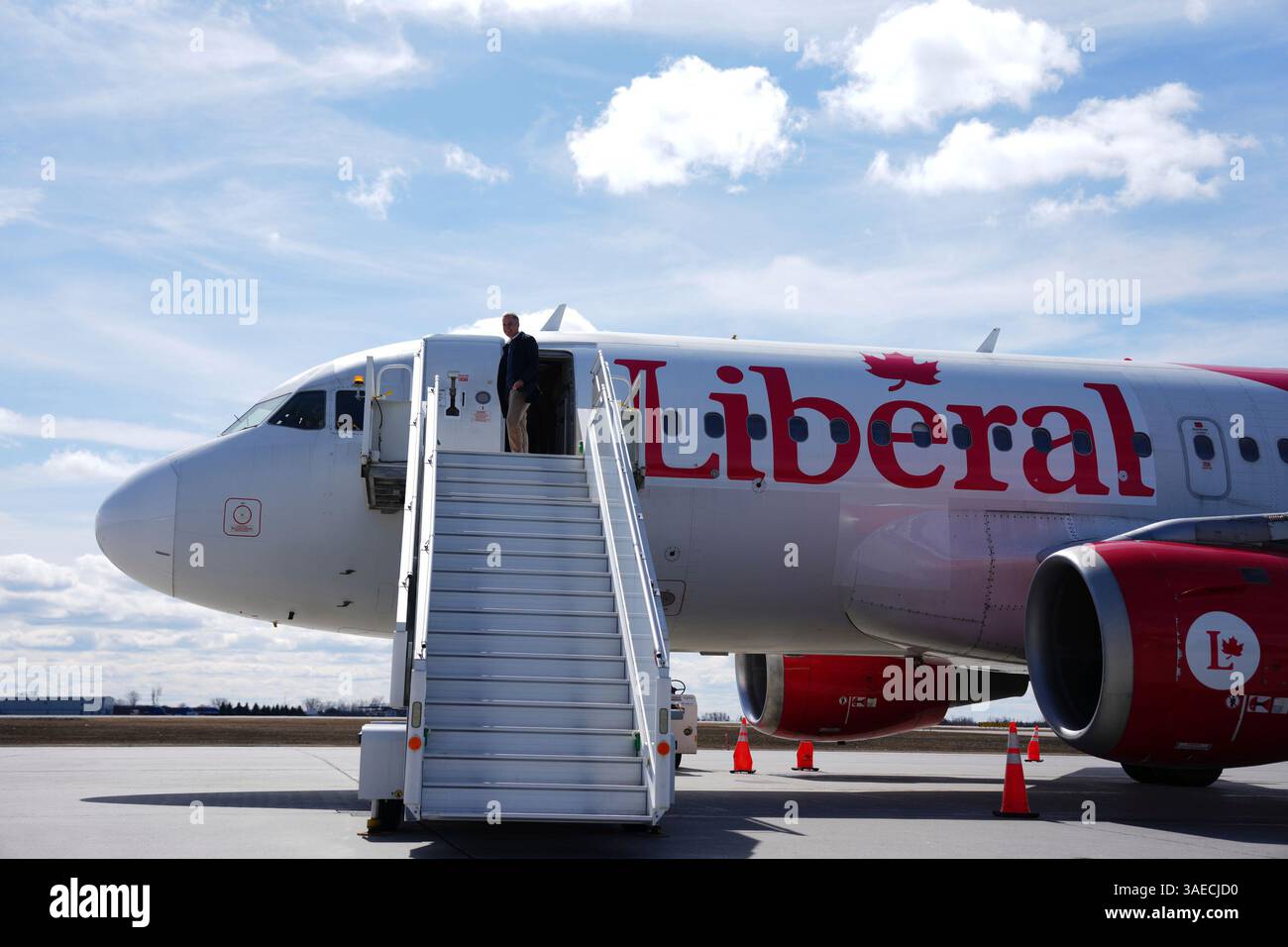 Canada Liberal leader Mark Carney boards his campaign plane in Ottawa ...