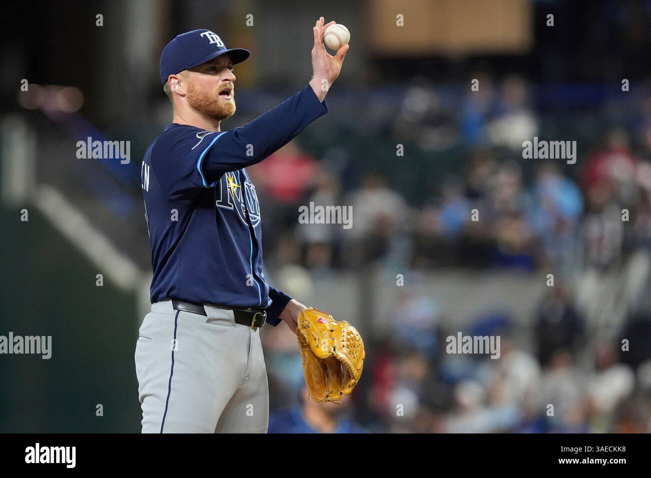 Tampa Bay Rays starting pitcher Drew Rasmussen asks for a new game ball ...