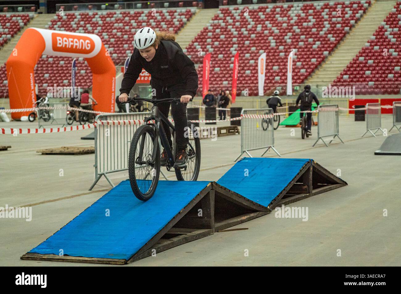 A young cyclist rides a bike on the Expo test course On the morning of ...