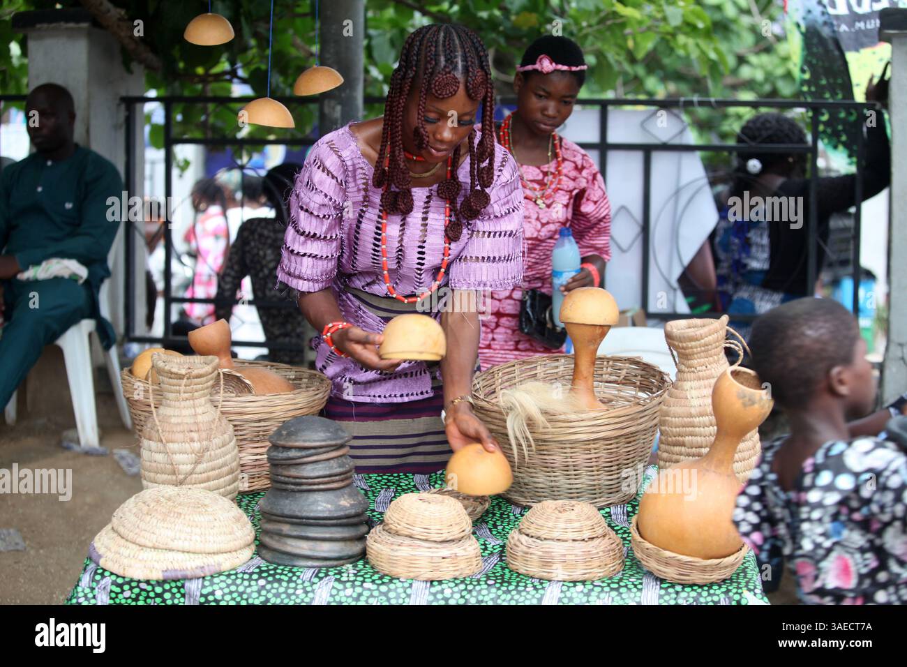 Abeokuta, Nigeria. 05th Apr, 2025. A woman arranges her traditional ...