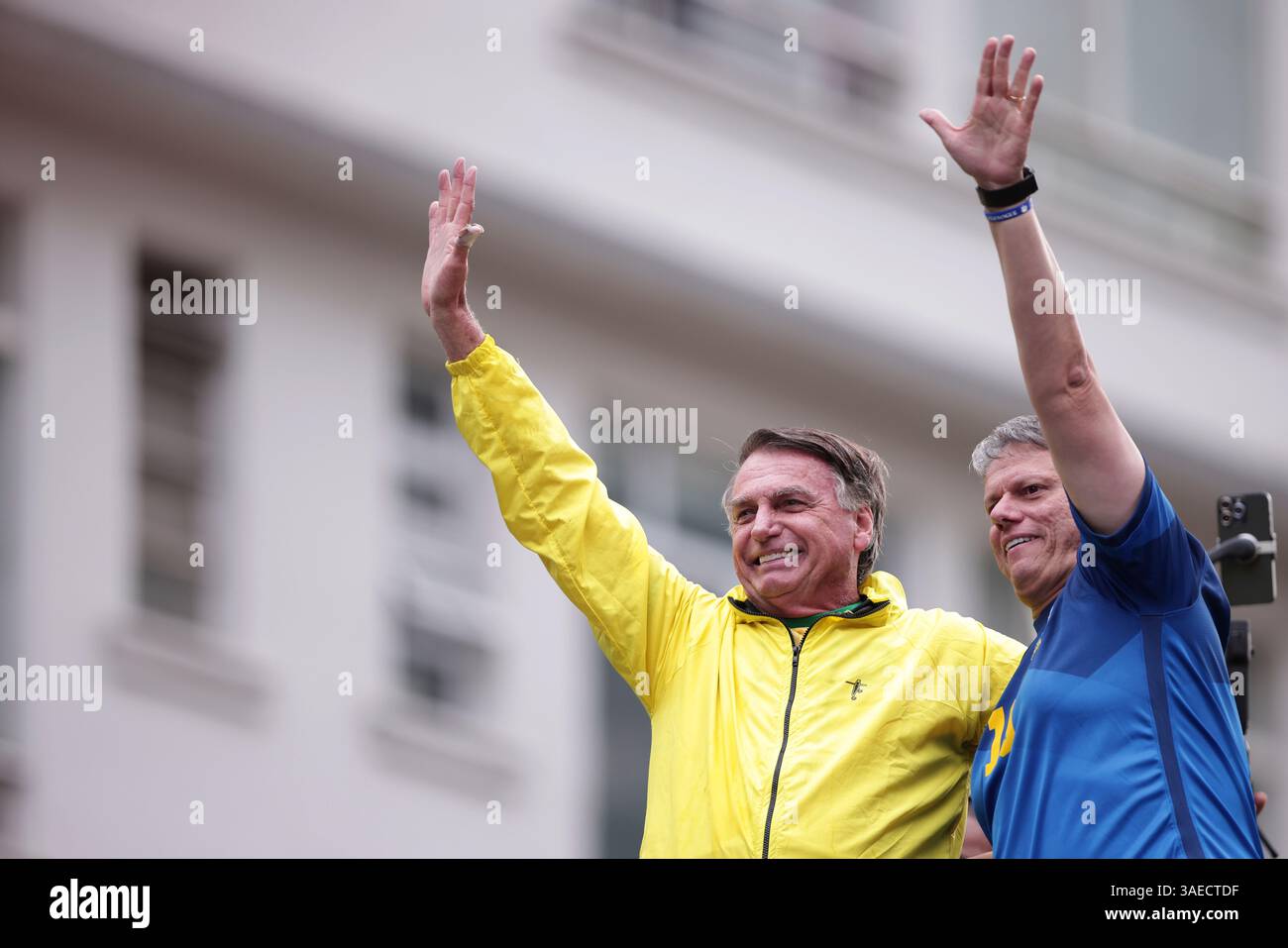 Sao Paulo Governor Tarcisio de Freitas, right, and former President ...
