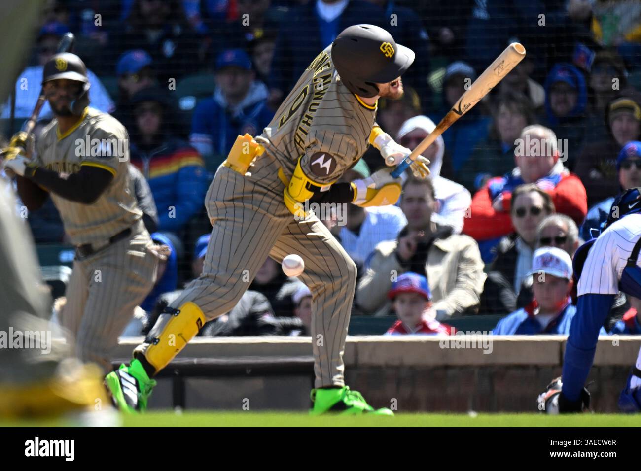 San Diego Padres' Jake Cronenworth gets hit by a pitch thrown by ...