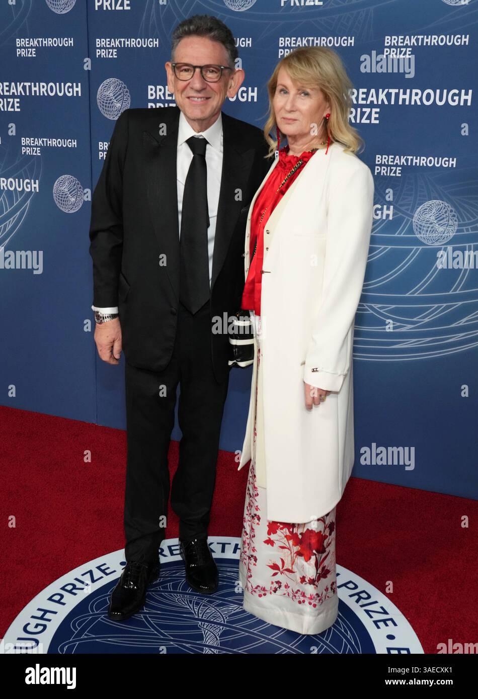 Lucian Grainge, left, and Caroline Grainge arrive at the 11th ...