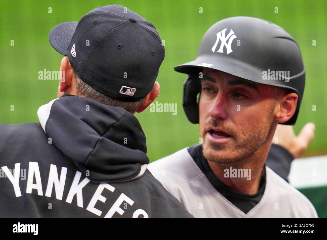 New York Yankees' Cody Bellinger, right, his greeted on the dugout ...