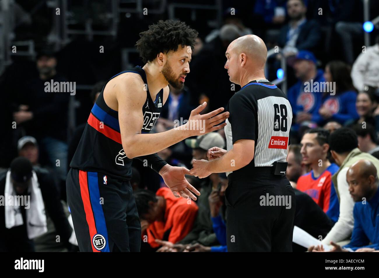 Detroit Pistons guard Cade Cunningham, left, argues a call with referee ...