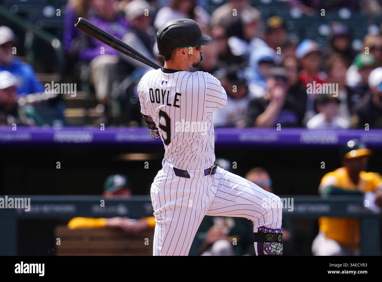 Colorado Rockies' Brenton Doyle follows the flight of his double to ...