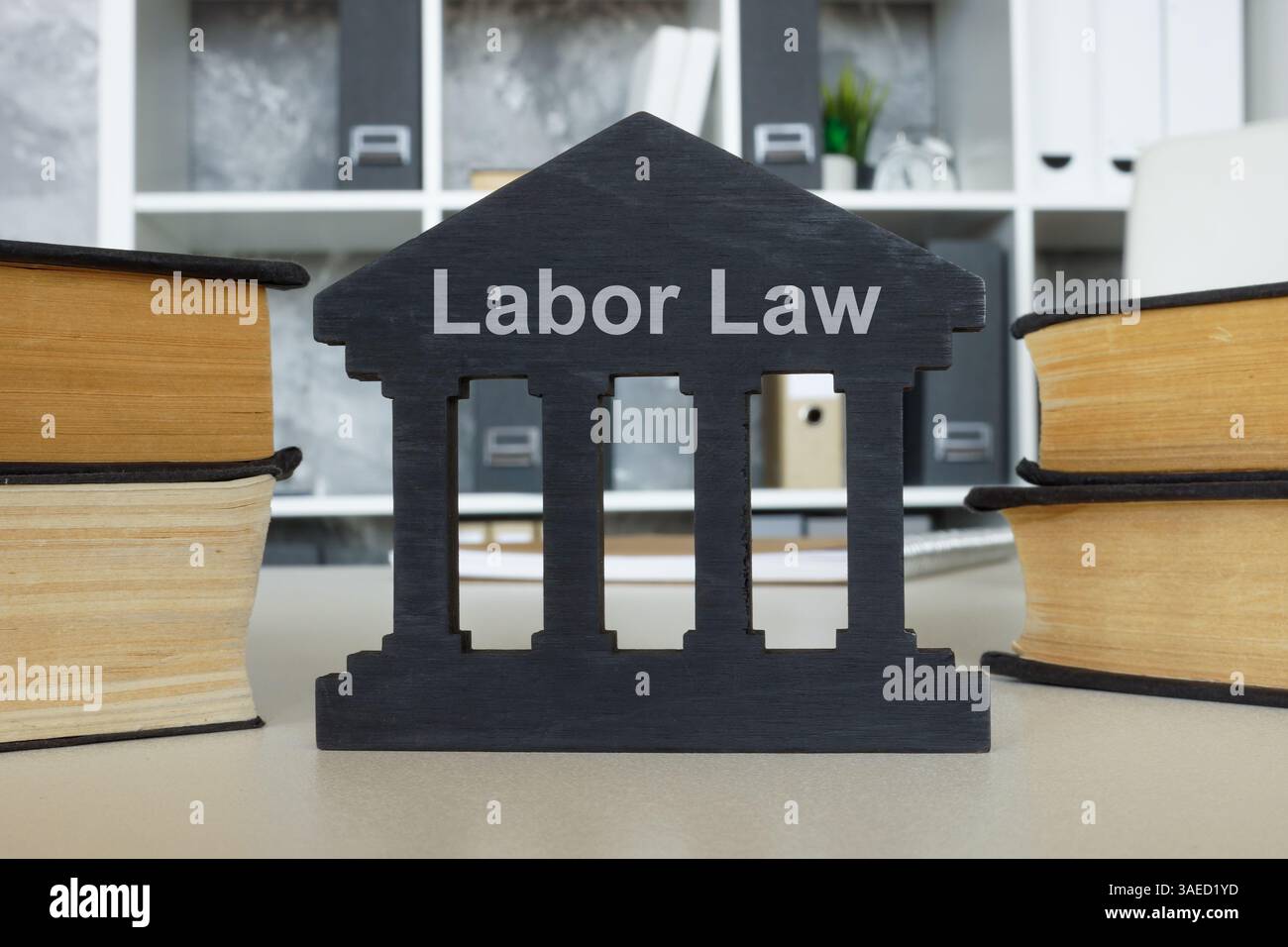 Sign labeled labor law in an office. Workplace regulations and employee ...