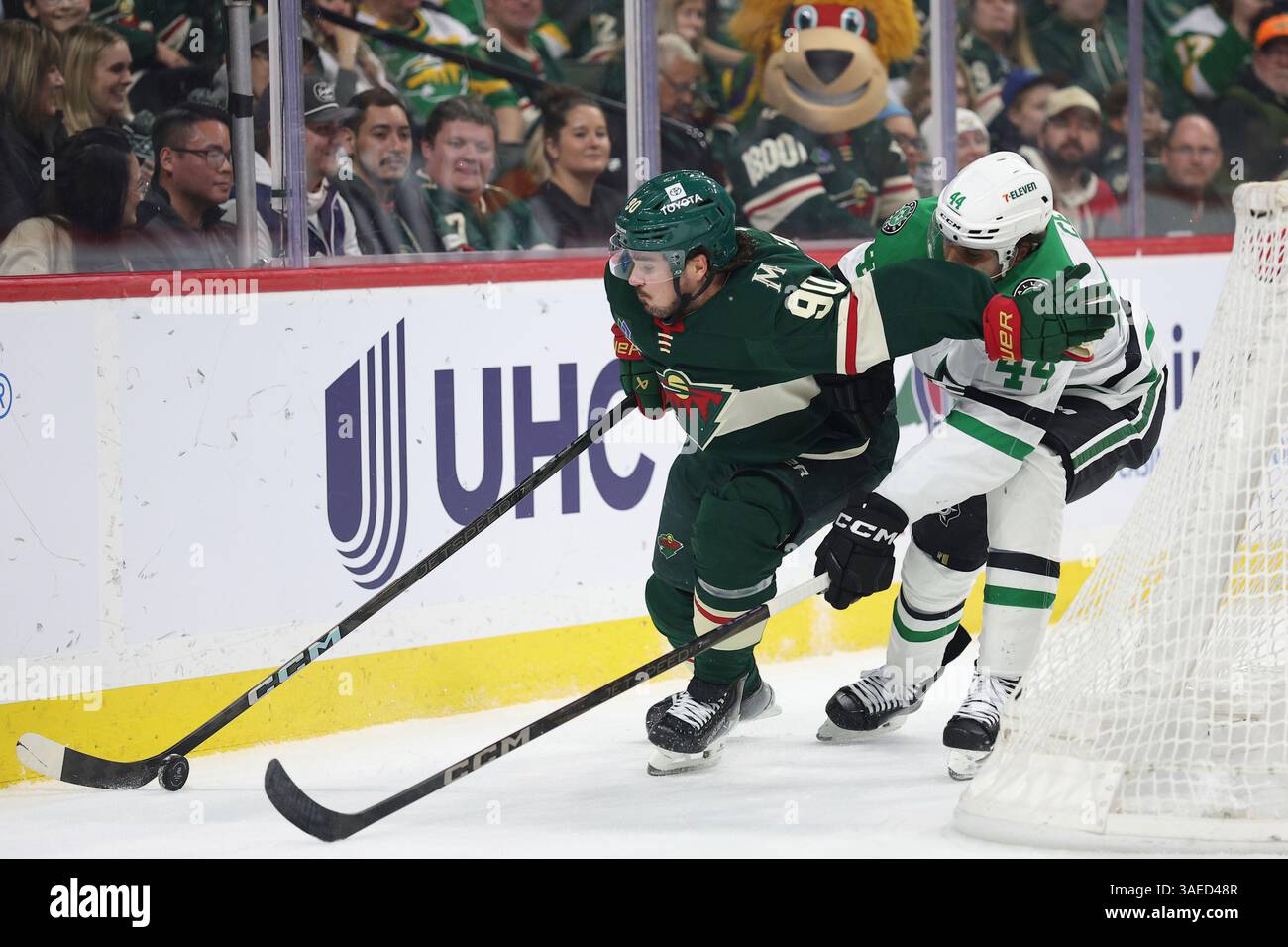 Minnesota Wild left wing Marcus Johansson, left, skates with the puck ...