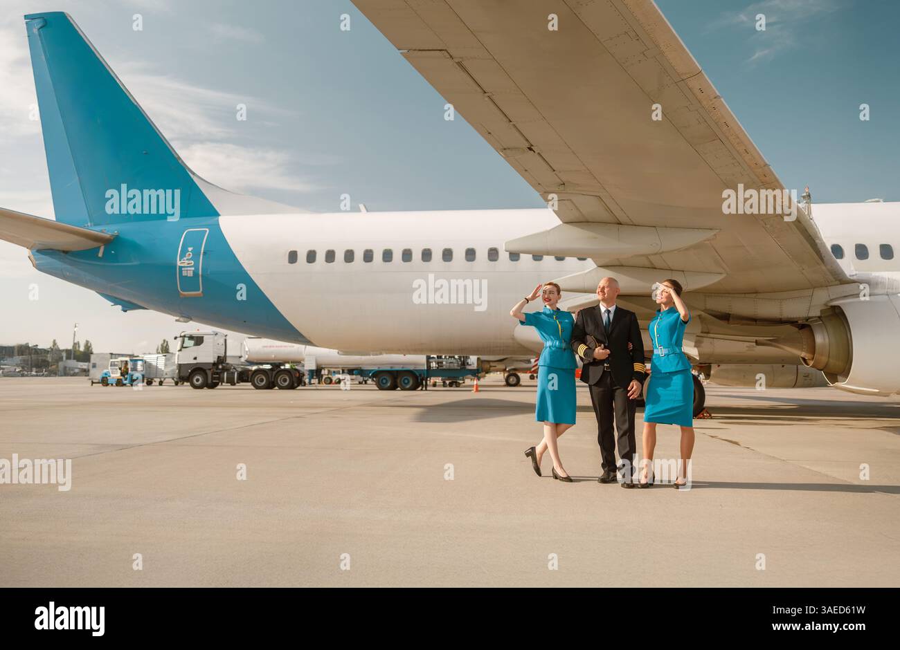 An esteemed Airline Crew Member is actively engaging with a passenger ...