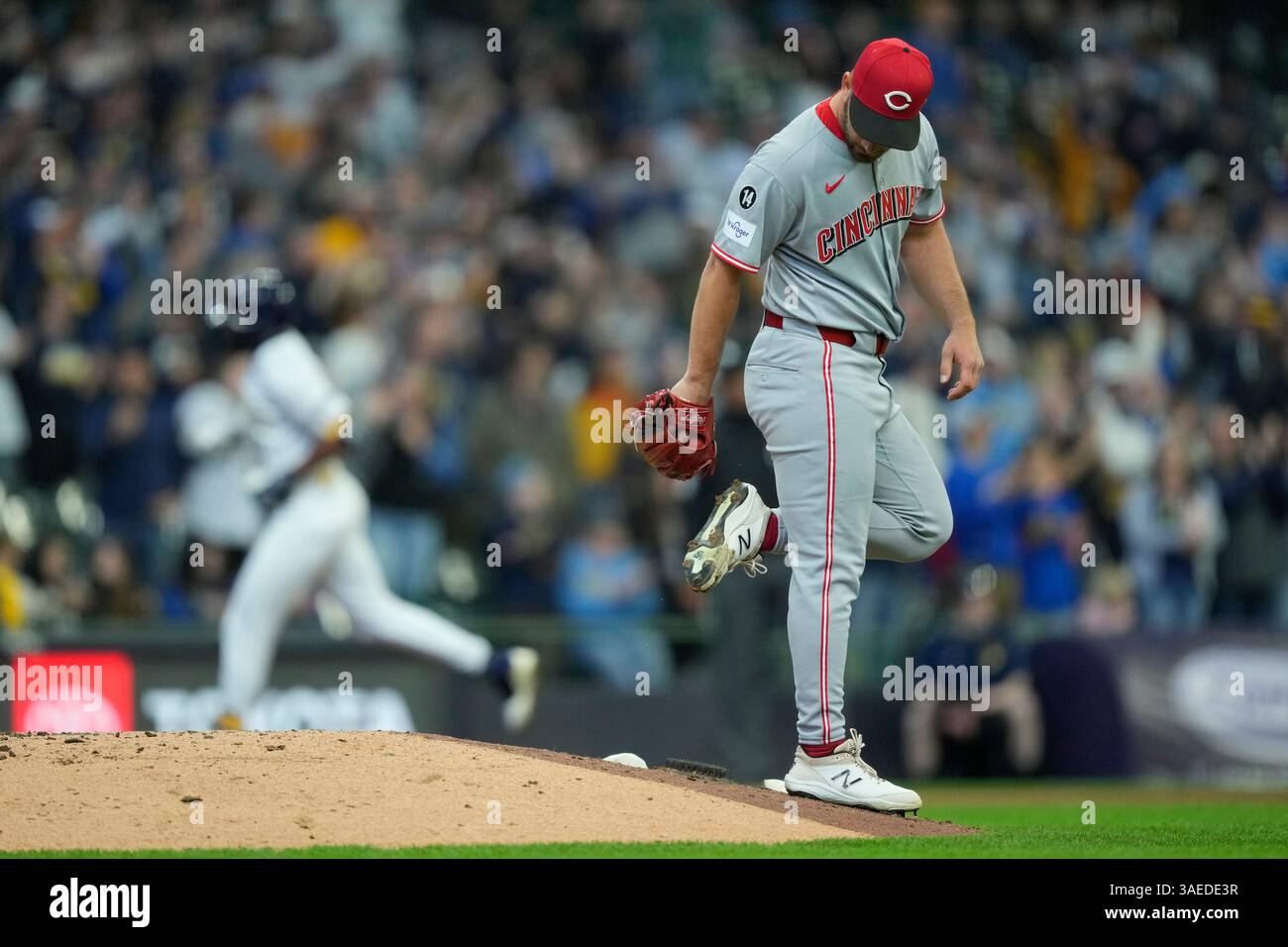 Cincinnati Reds' Sam Moll reacts after giving up a three-run home run ...