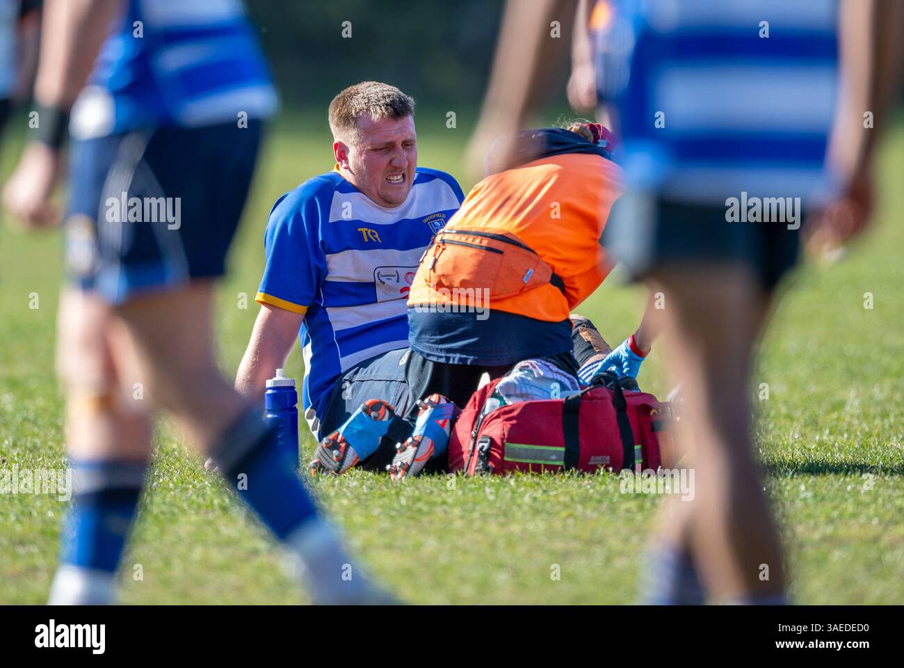 Mens amateur Rugby Union game, player receiving medical treatment to ...