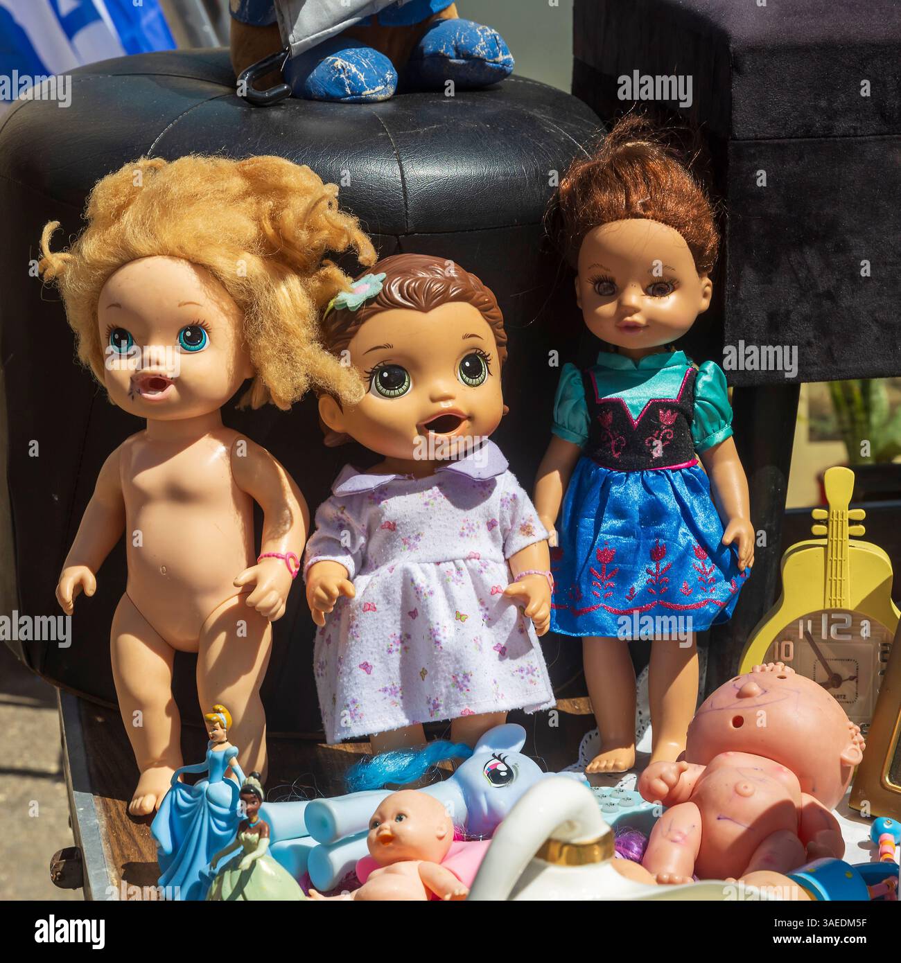 Haifa, Israel, April 5, 2025, Assortment of used dolls with various ...