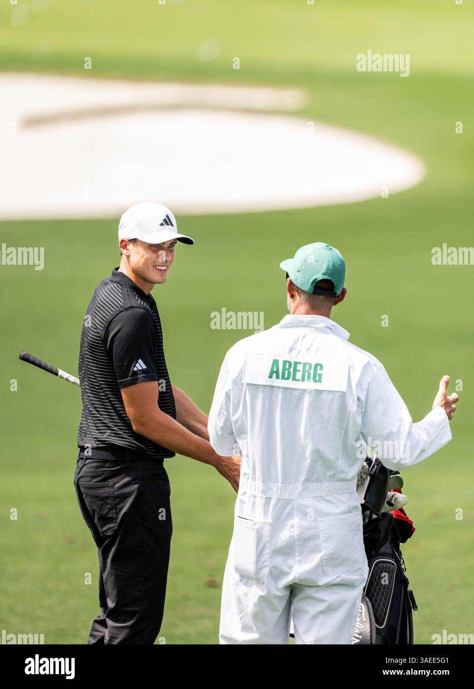 Ludvig Åberg of, Sweden. , . with caddie Joe Skovron during a practice ...