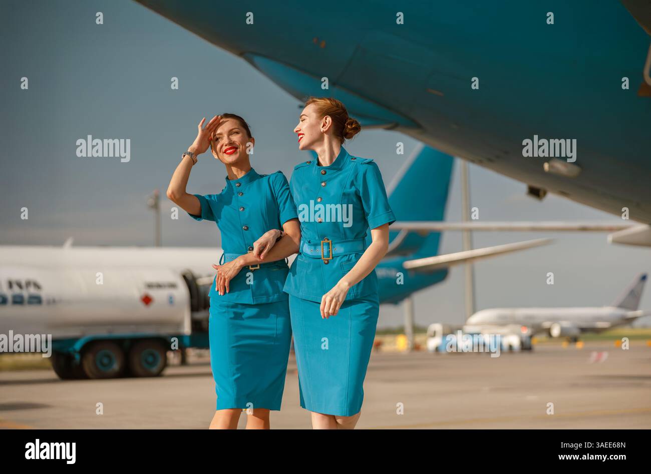 The Stylish Airline Crew at the Airport Dressed in Trendy Blue Uniforms ...