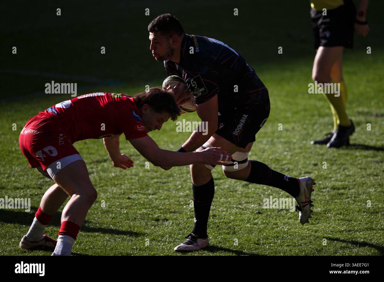 Swansea, UK. 6 April, 2025. Rhys Davies of Ospreys is tackled by Ellis ...