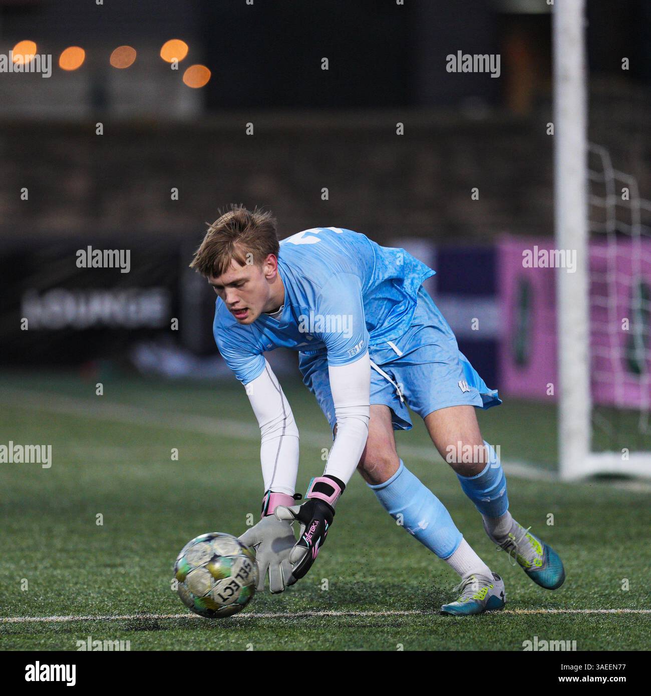 Madison, Wisconsin, USA. 5th Apr, 2025. LUKE SHIVERS of the University of Wisconsin scoops up an ...