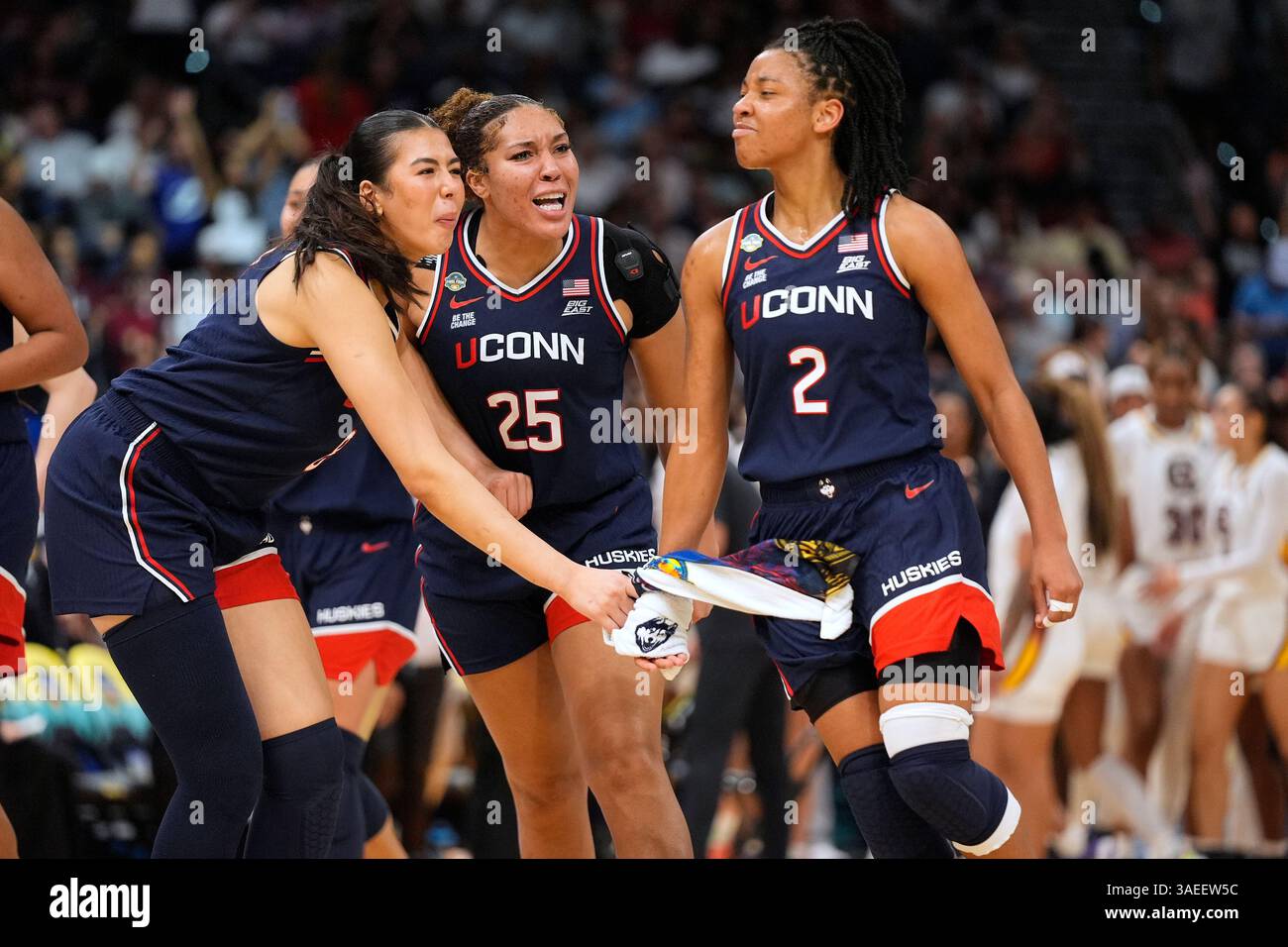 UConn center Jana El Alfy (8), forward Ice Brady (25) and guard Morgan Cheli (23) react during ...