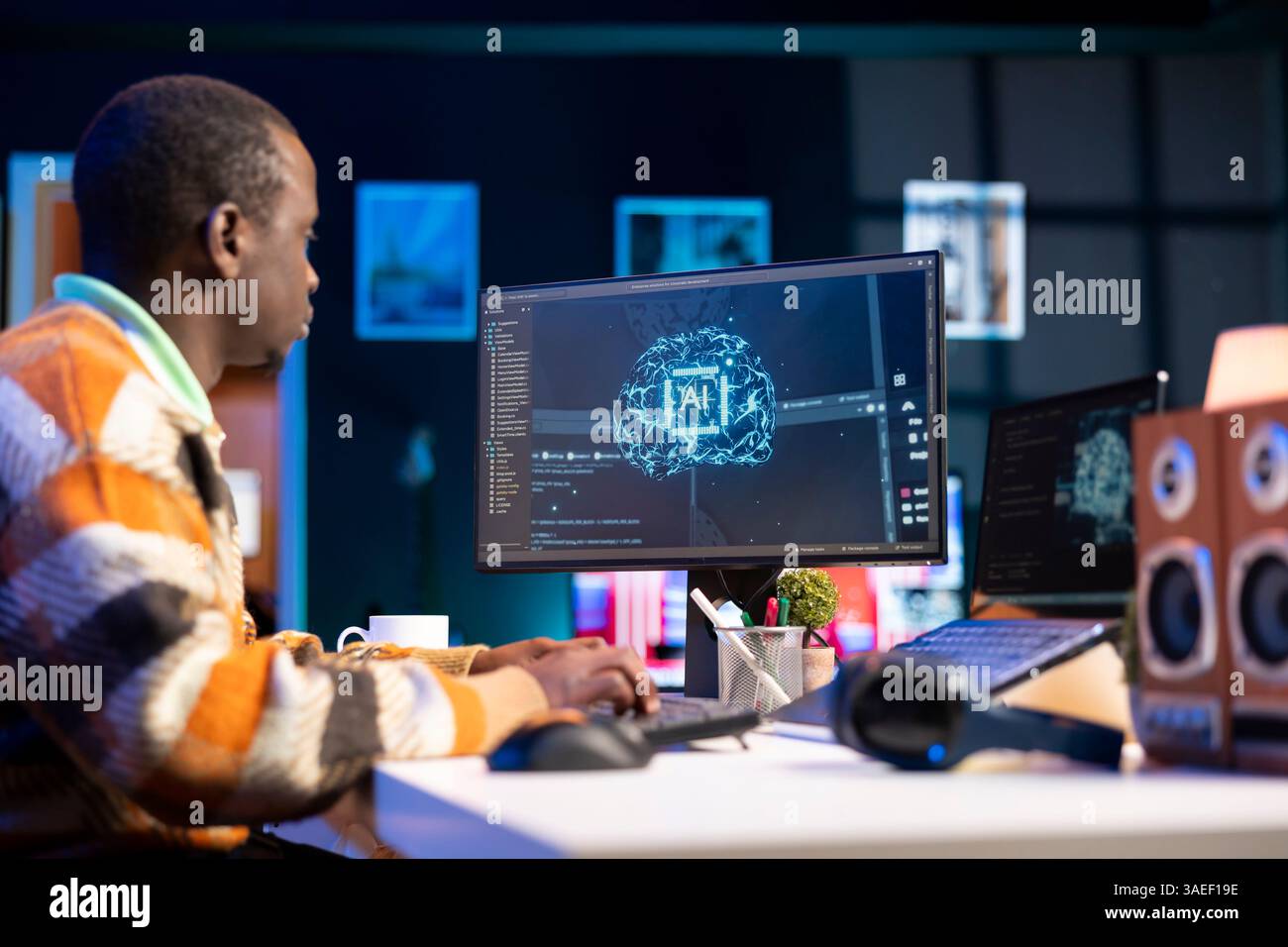 African american IT professional managing AI system for machine learning, coding software on ...