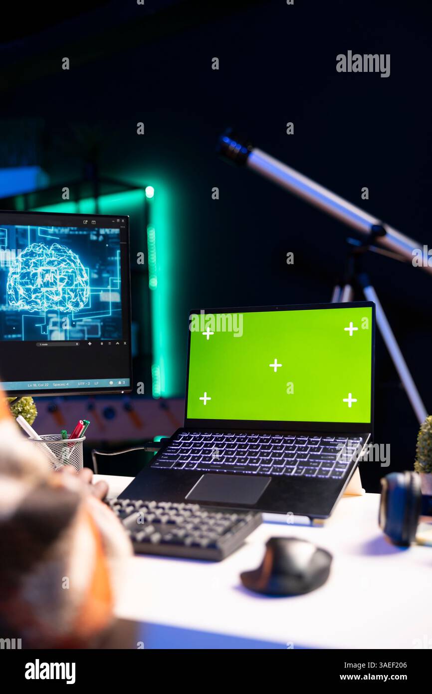 African american web developer using isolated mockup on pc and writing code, working with ...