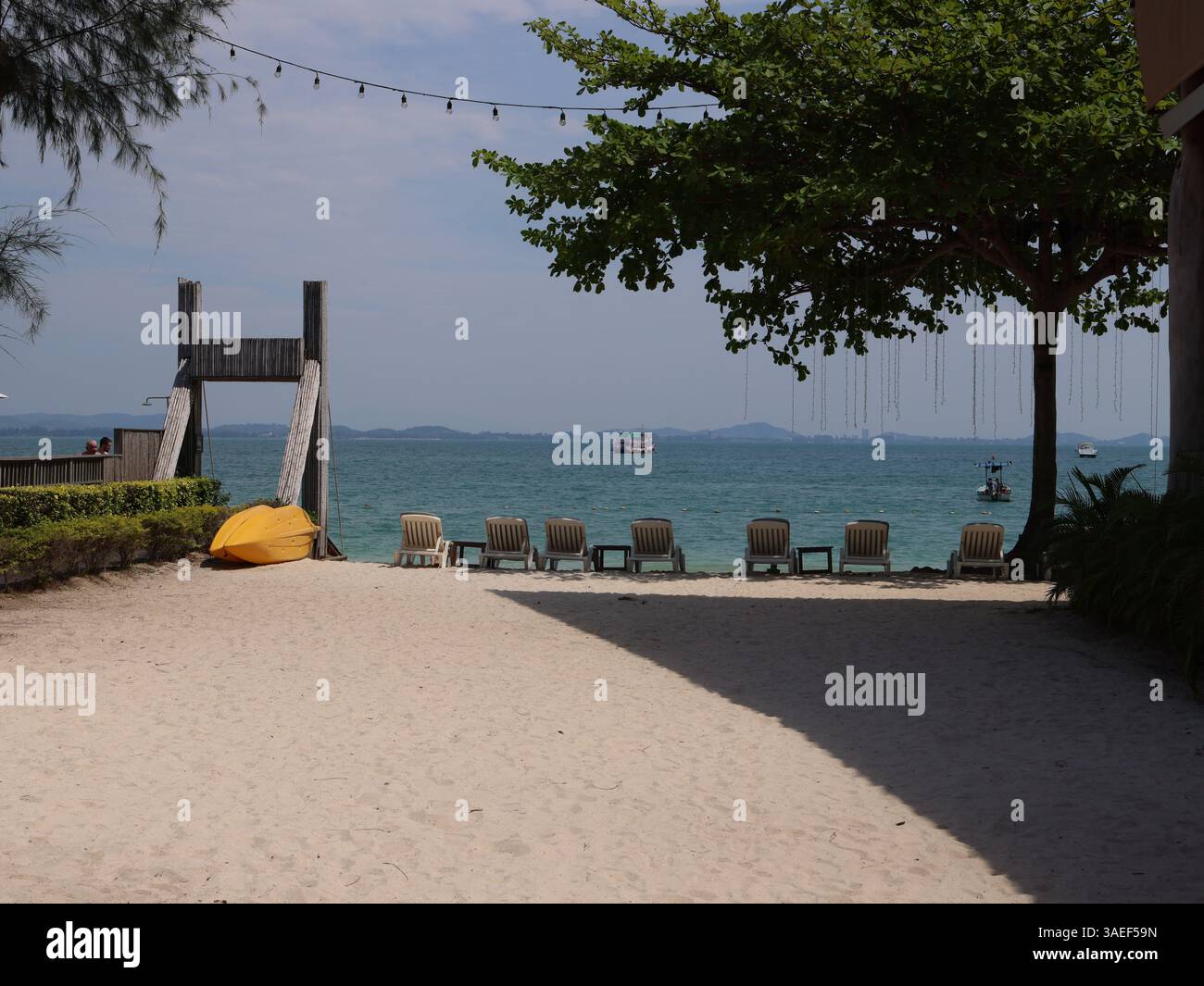 A Beautiful and Relaxing Beach Scene Featuring Loungers with a Scenic ...