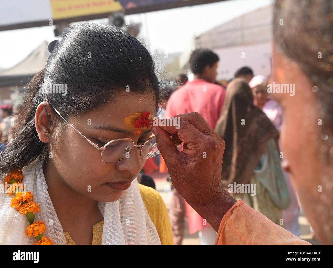 PATNA, INDIA - APRIL 6: A devotee putting 'Jai Shri Ram' Tilak on head ...