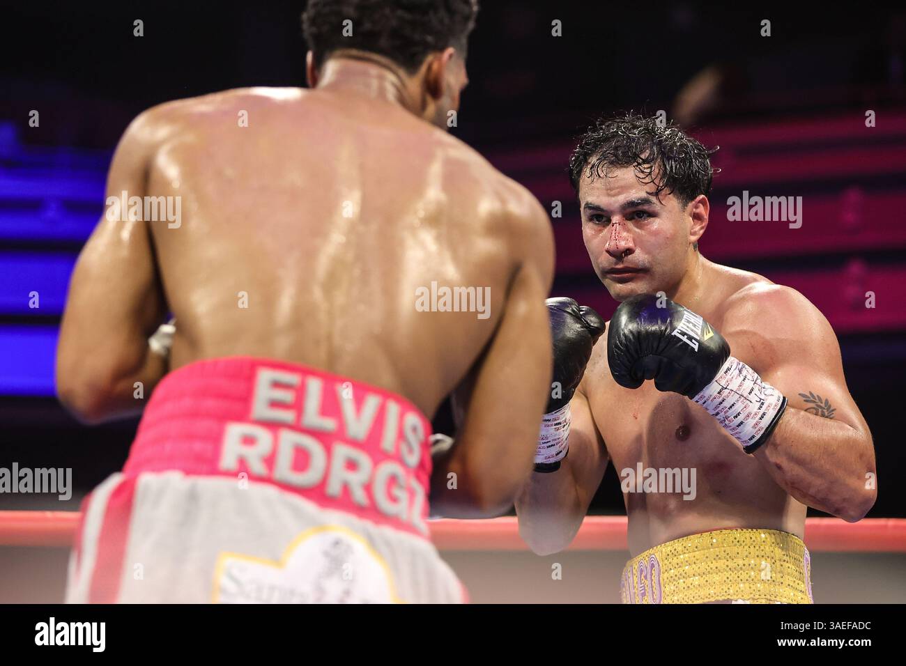 April 5, 2025: (R-L) Junior Welterweight Lindolfo Delgado in action ...