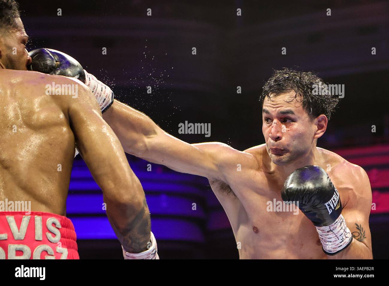 April 5, 2025: (R-L) Junior Welterweight Lindolfo Delgado punches Elvis ...