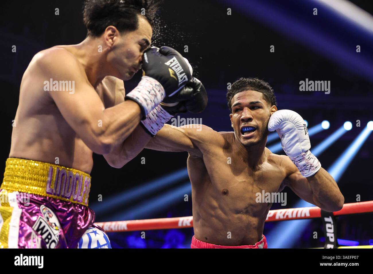 April 5, 2025: (R-L) Junior Welterweight Elvis Rodriguez punches ...