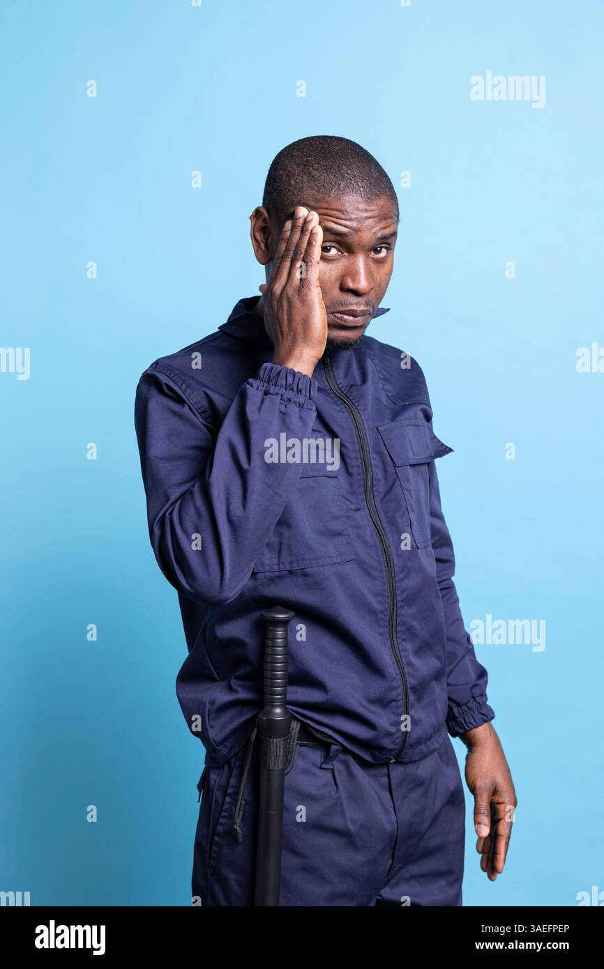 African american patrol officer is feeling tired and unwell from a ...