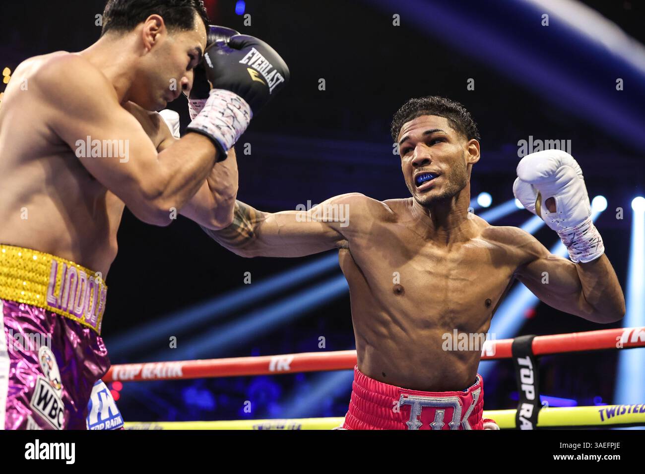 April 5, 2025: (R-L) Junior Welterweight Elvis Rodriguez throws a punch ...