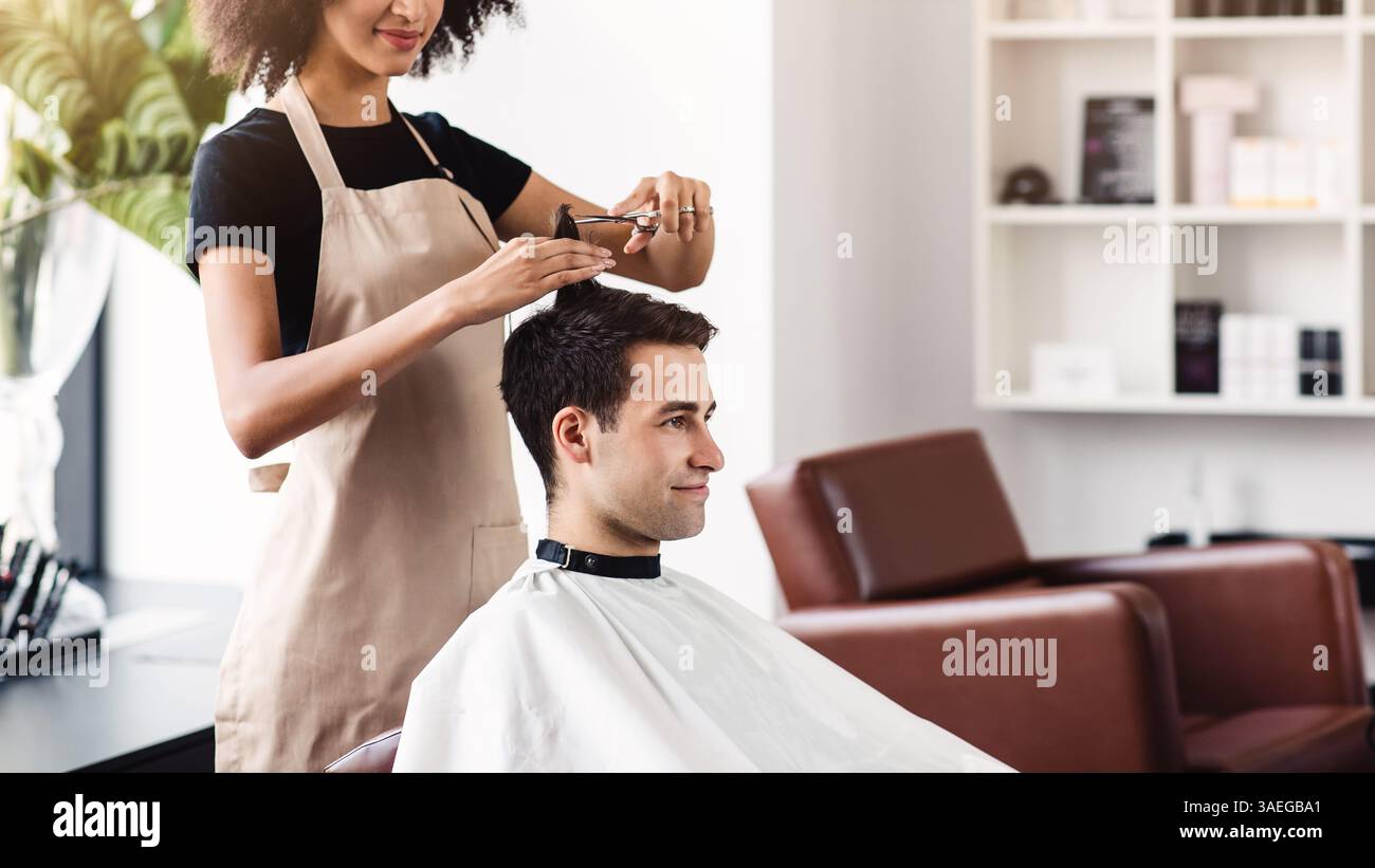 Handsome guy getting new hairstyle hi-res stock photography and images ...