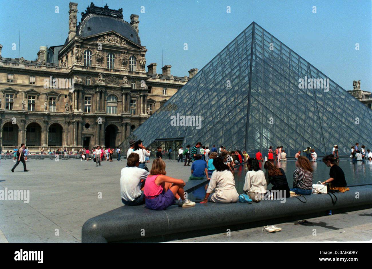 The glass pyramid presents a sharp contrast between the modern and old ...