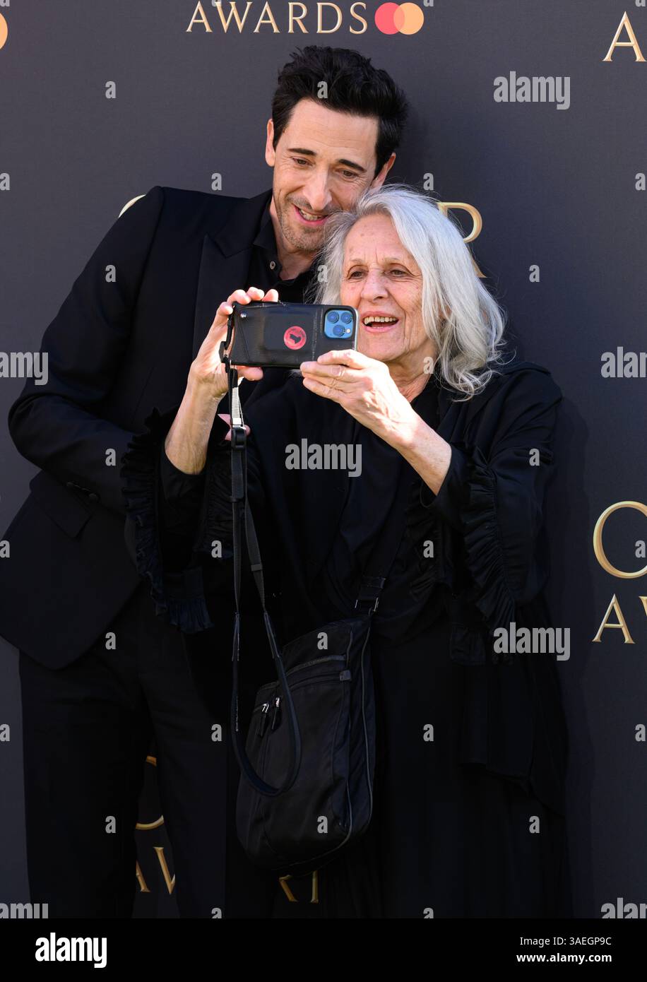 London, UK. April 6th, 2025. Adrien Brody and mother arriving at The ...