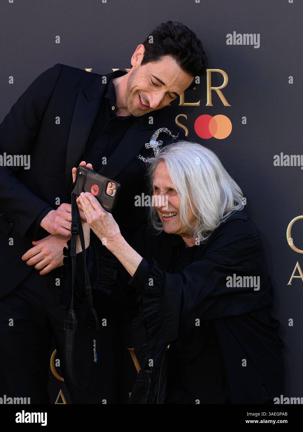 London, UK. April 6th, 2025. Adrien Brody and mother arriving at The ...