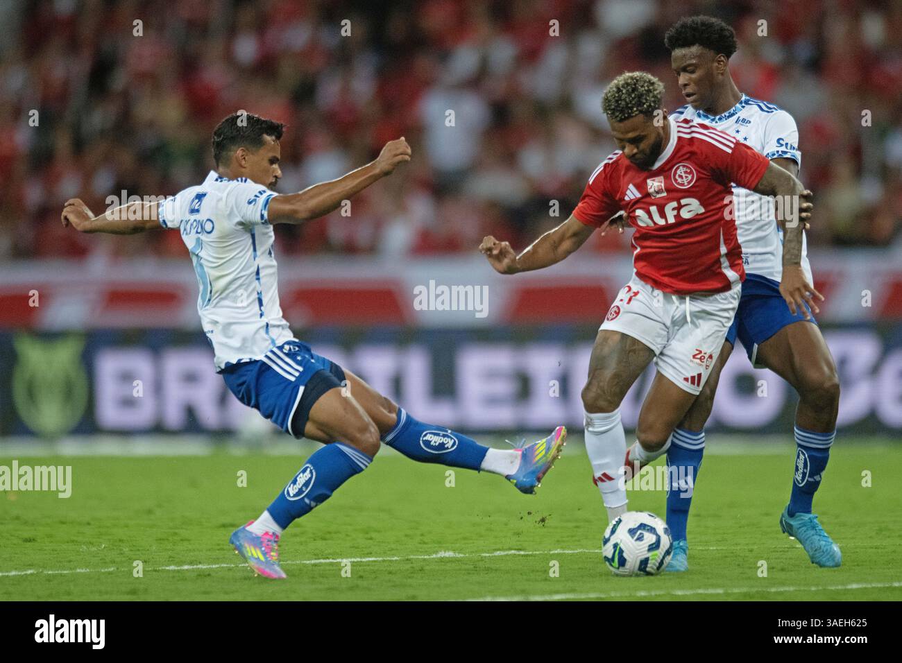 Porto Alegre, Brazil. 06th Apr, 2025. Wesley of Internacional battles for possession ball with ...