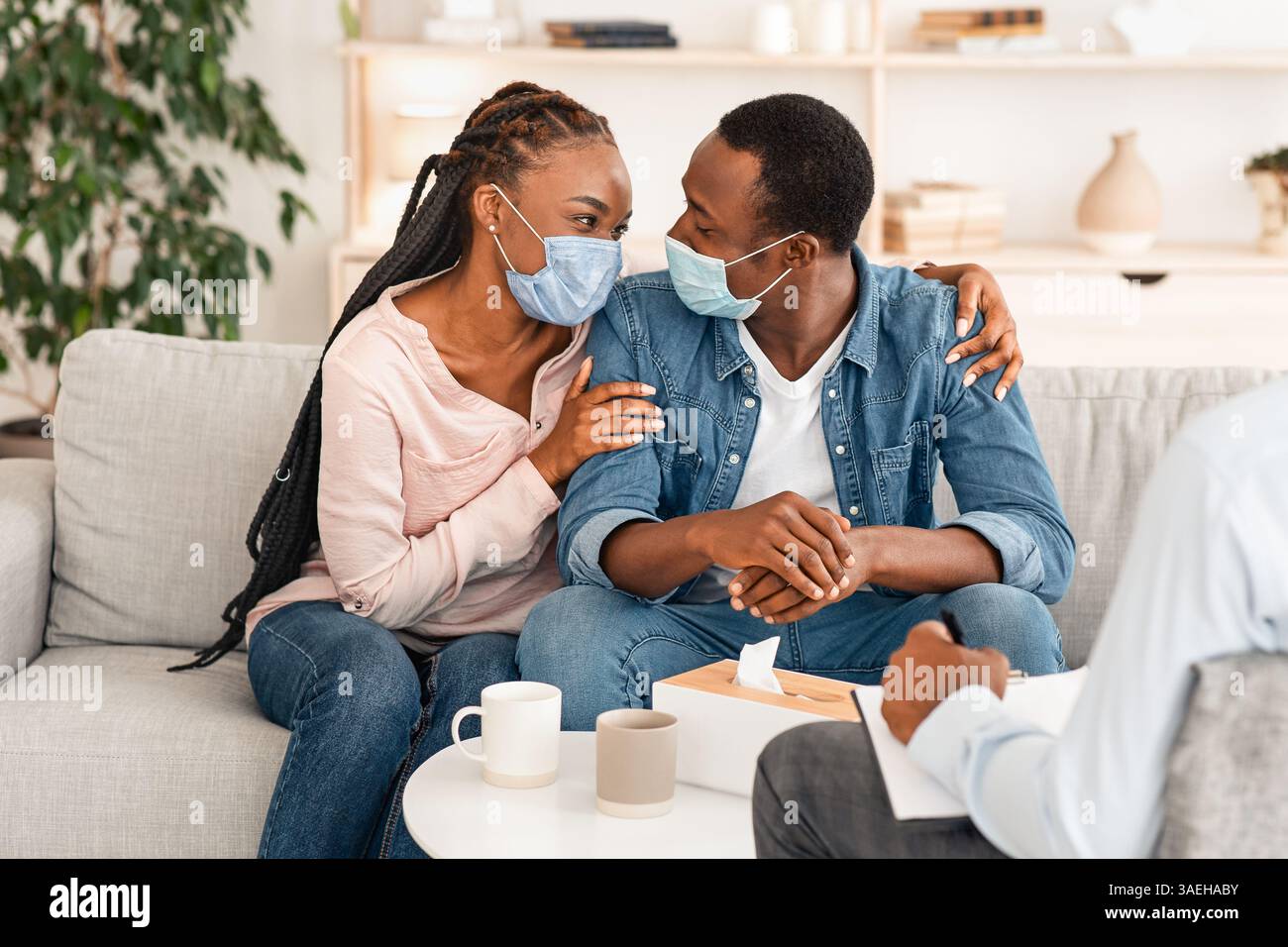 Saved Marriage. Happy Black Couple In Medical Masks Embracing At ...