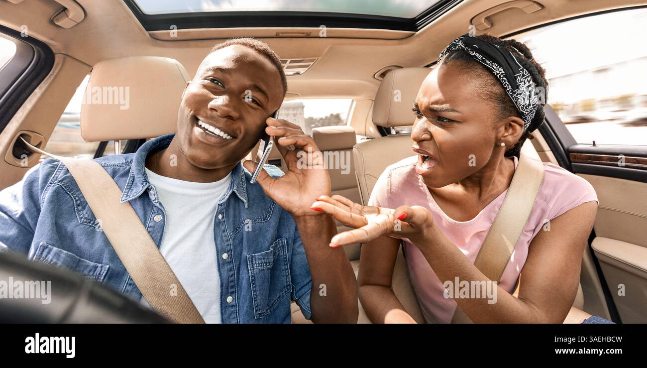 Black woman yelling at boyfriend having phone call while driving Stock ...