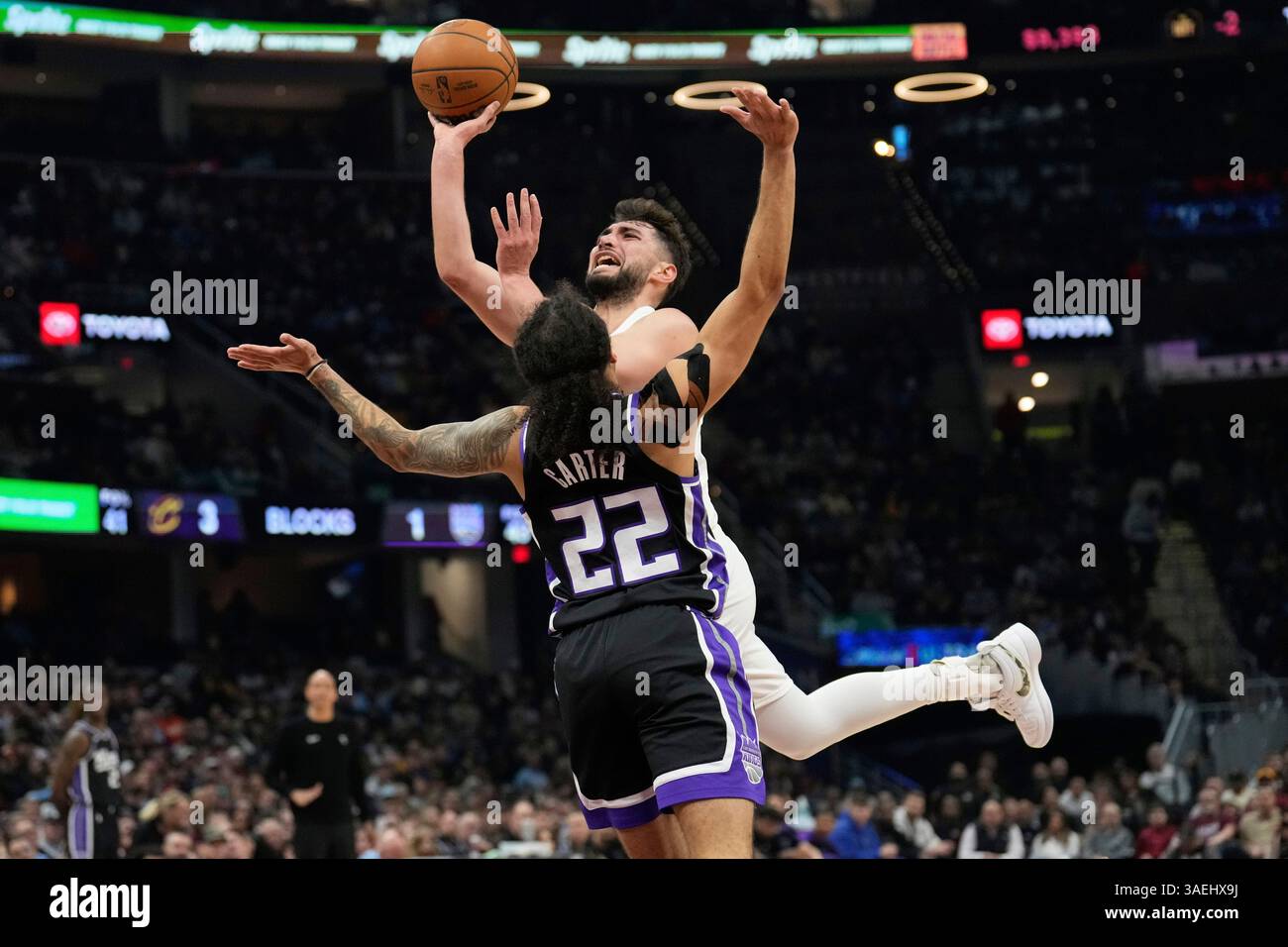 Cleveland Cavaliers guard Ty Jerome, right, shoots as Sacramento Kings ...
