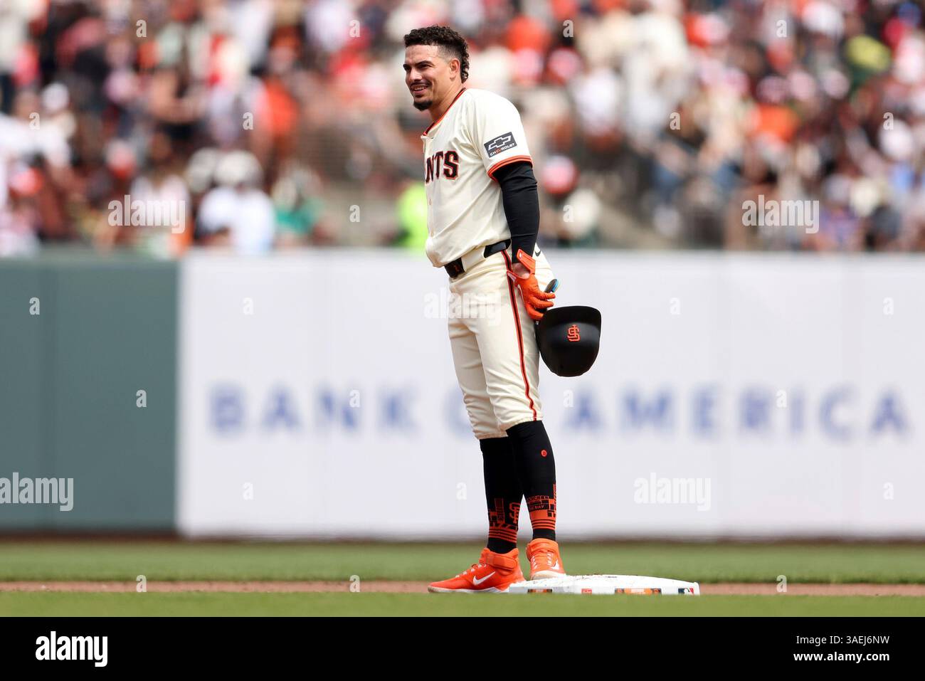 San Francisco Giants' Willy Adames smiles while standing on second base ...