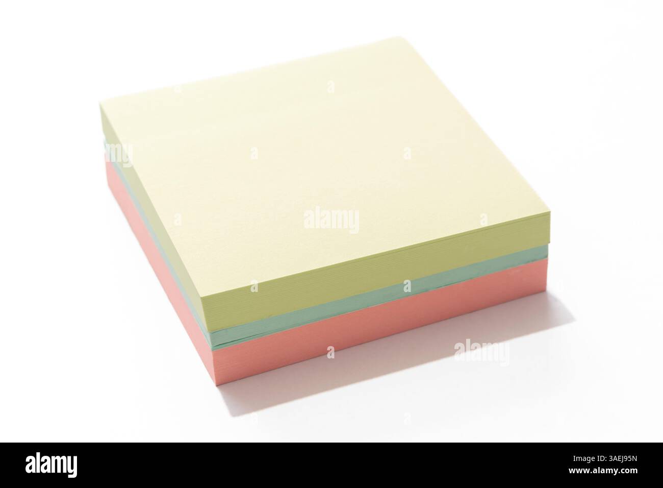 A stack of different colored post it notes isolated on a white ...