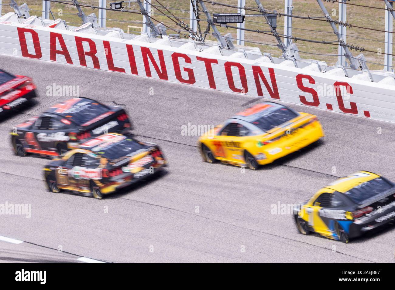 Drivers compete during a NASCAR Cup Series auto race at Darlington ...