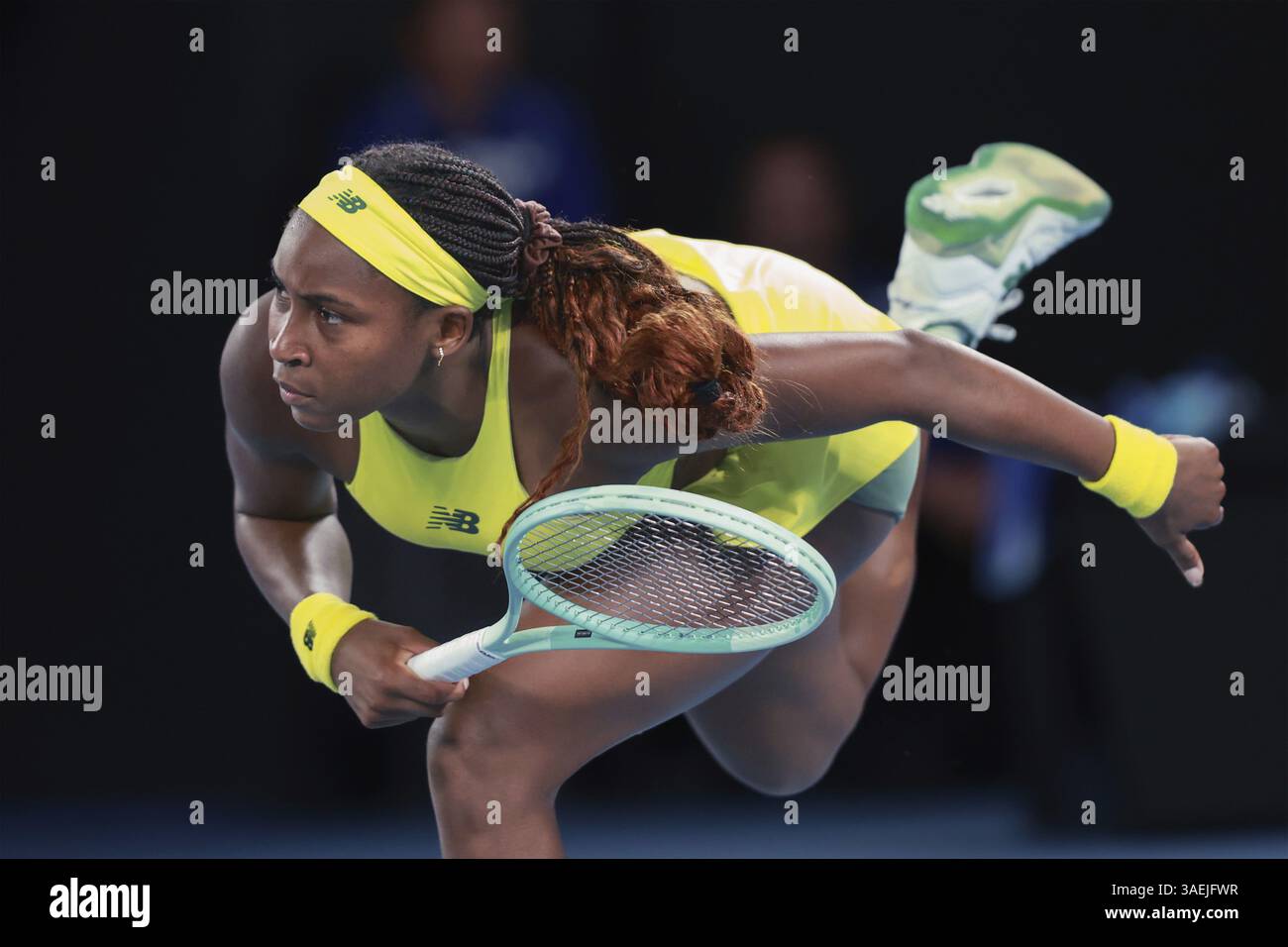American tennis player Coco Gauff (USA) playing a service shot at the Australian Open 2025 ...
