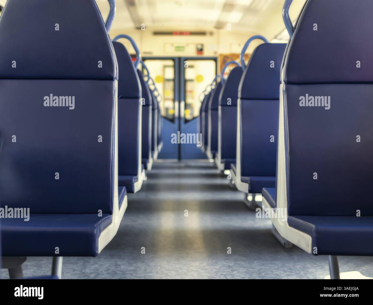 An empty train car with new blue leather seats Stock Photo - Alamy