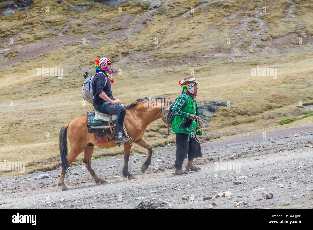 Peruvian people with horses offering tourists ride to the top of ...