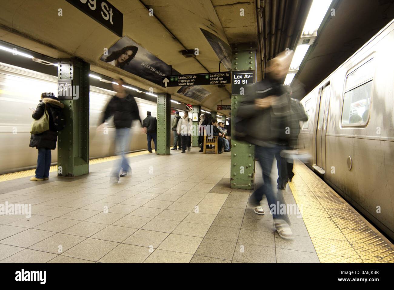 Commuter passengers waiting and walking in subway trainstation platform ...