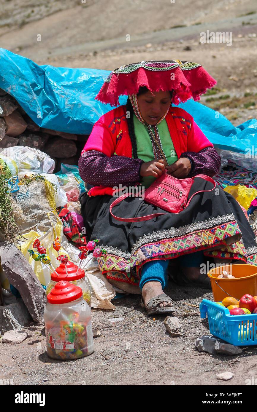 Peruvian traditional craft handmade dolls and textile. Colorful clothes ...