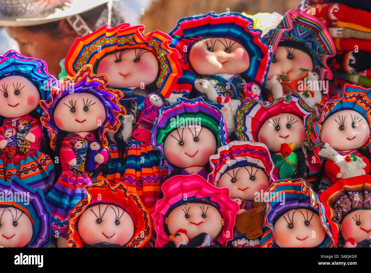 Peruvian traditional craft handmade dolls and textile. Colorful clothes ...